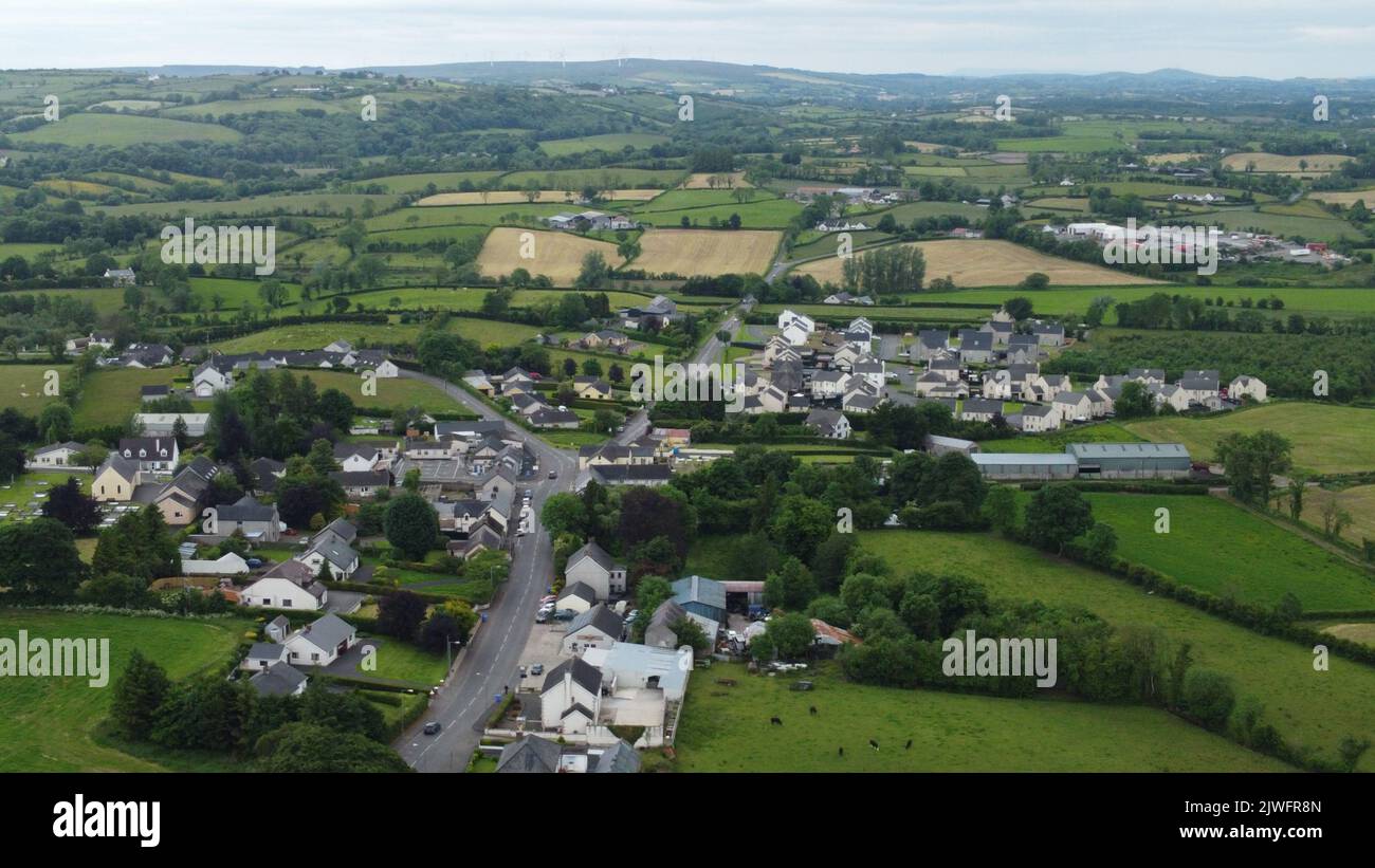 A beautiful view of the Seskinore Village with small houses and trees ...