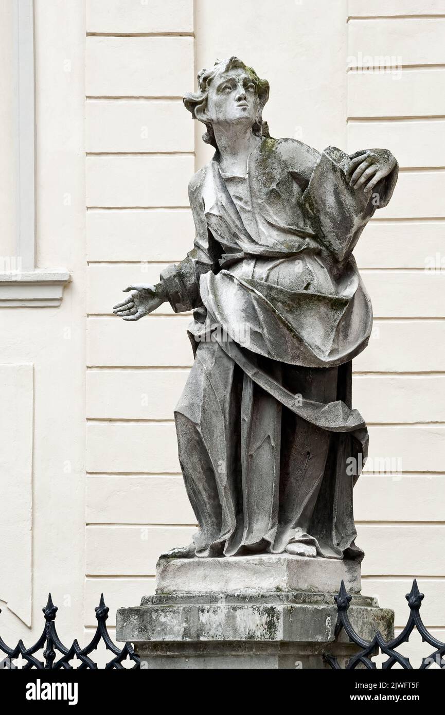 Statue with closed book of the Latin Cathedral, also known as the ...