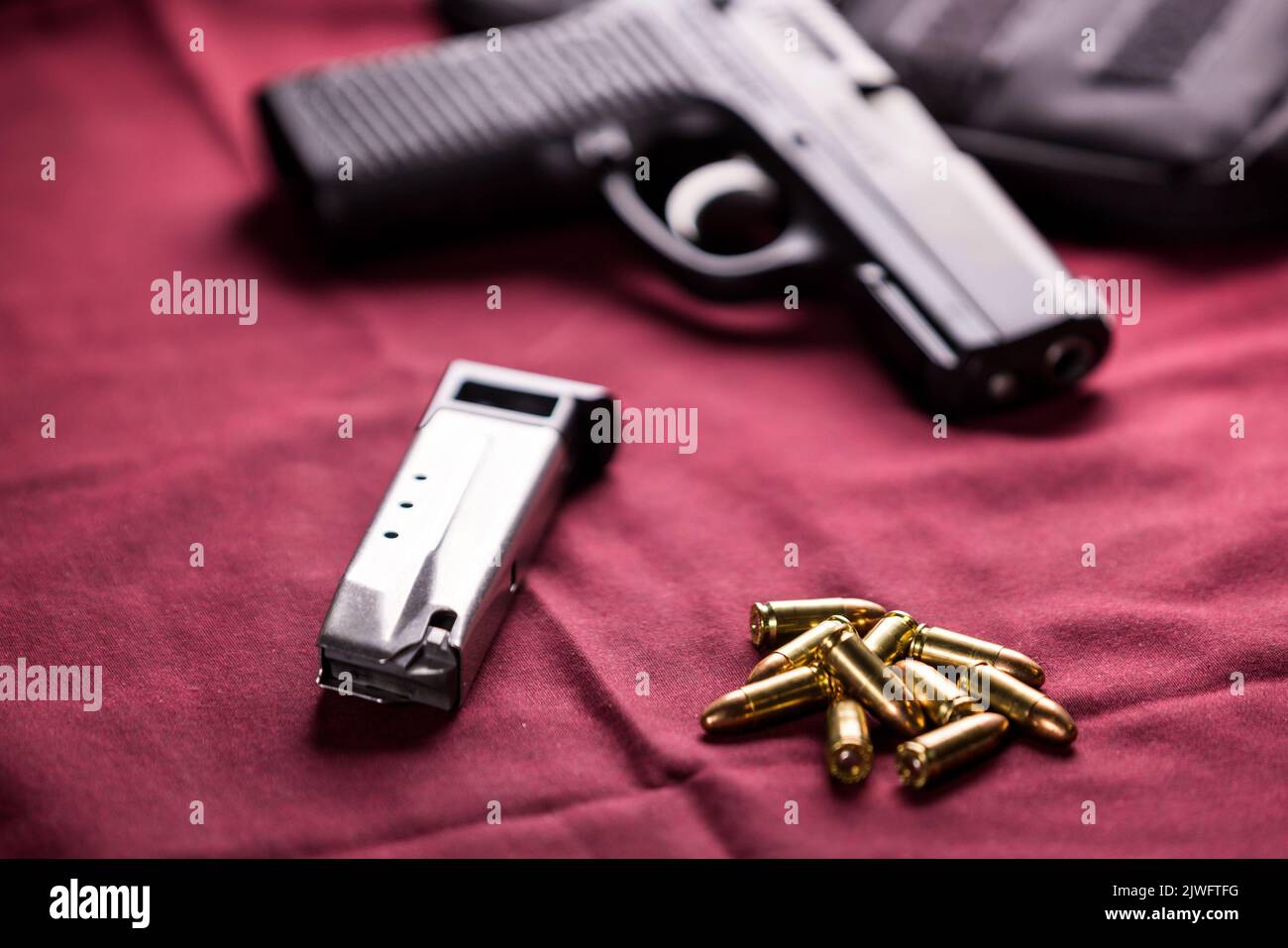 Black semi automatic pistol, 9mm bullets and a magazine Stock Photo - Alamy