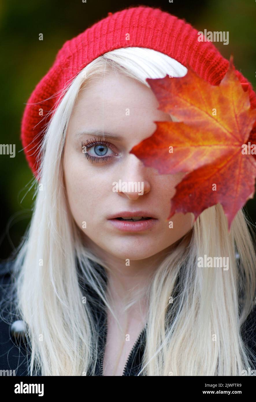Woman with hidden Eye from a colorful leaf Stock Photo - Alamy