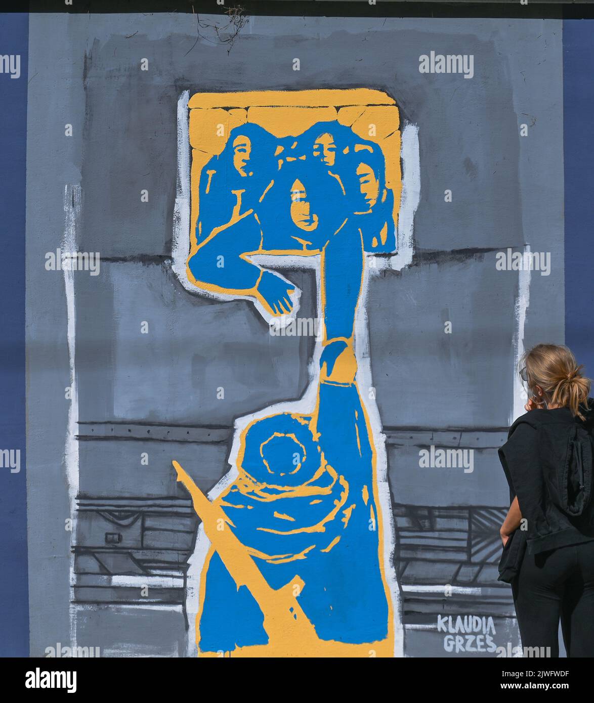 GDANSK, POLAND. 05 September 2022. Young woman looks at a pro-Ukrainian ...