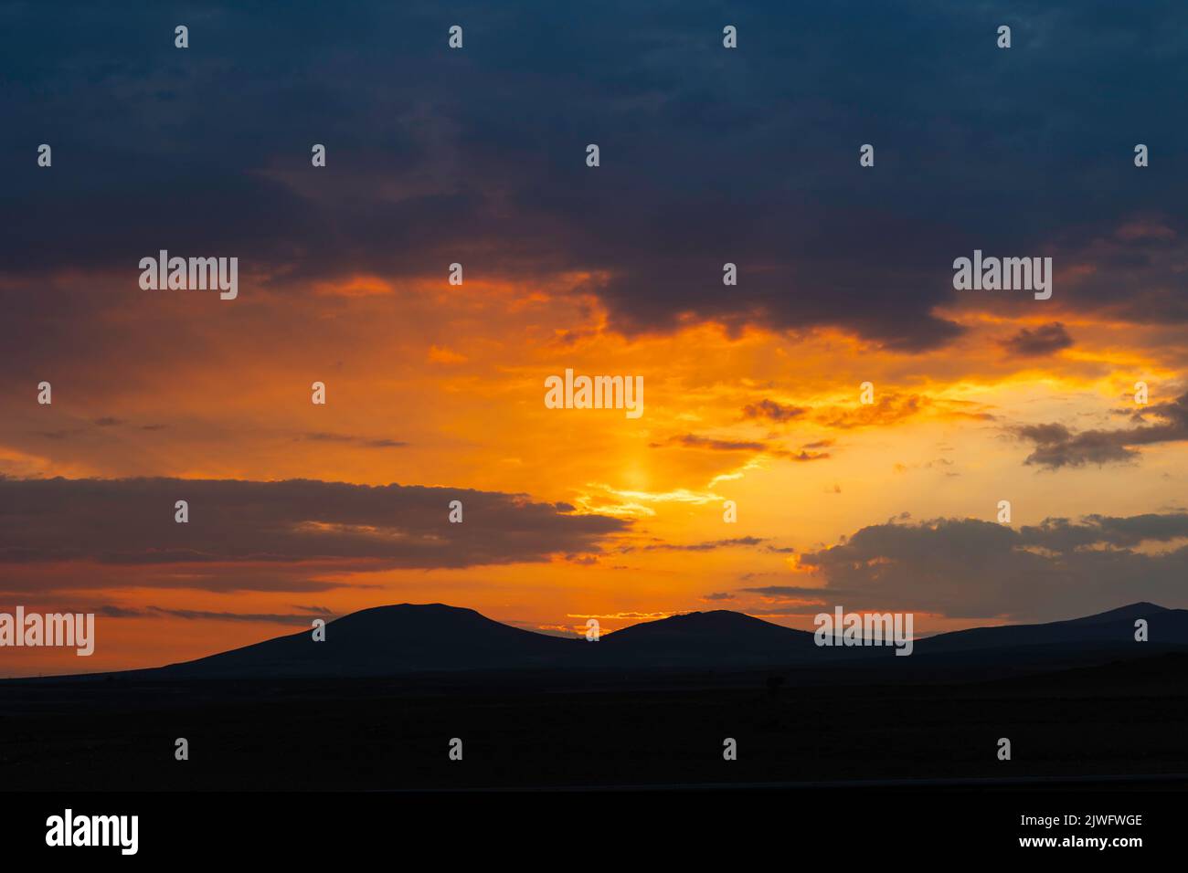 Inspirational quotes concept photo. Silhouette of hills at sunset or ...