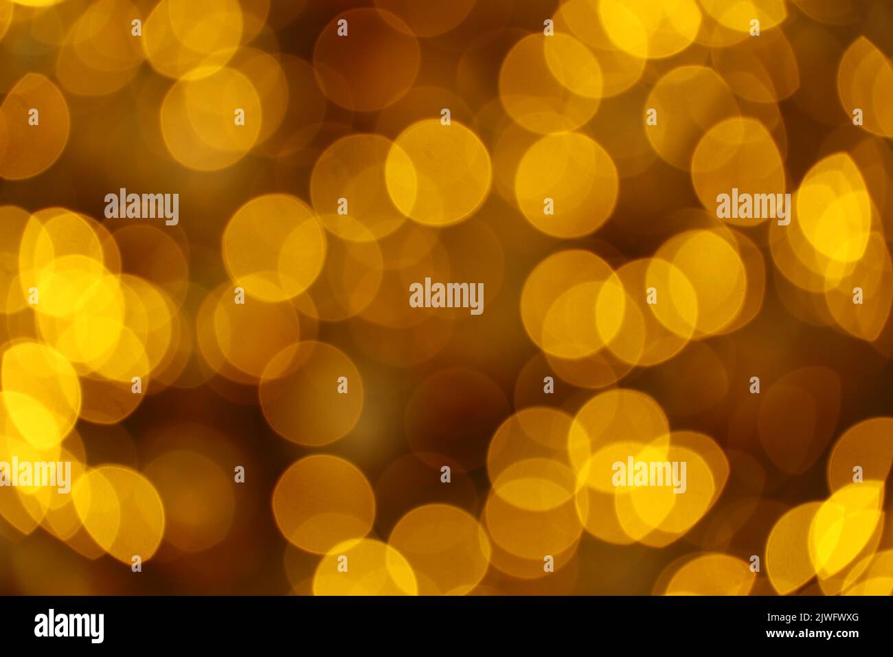 defocused golden light background material picture Stock Photo - Alamy