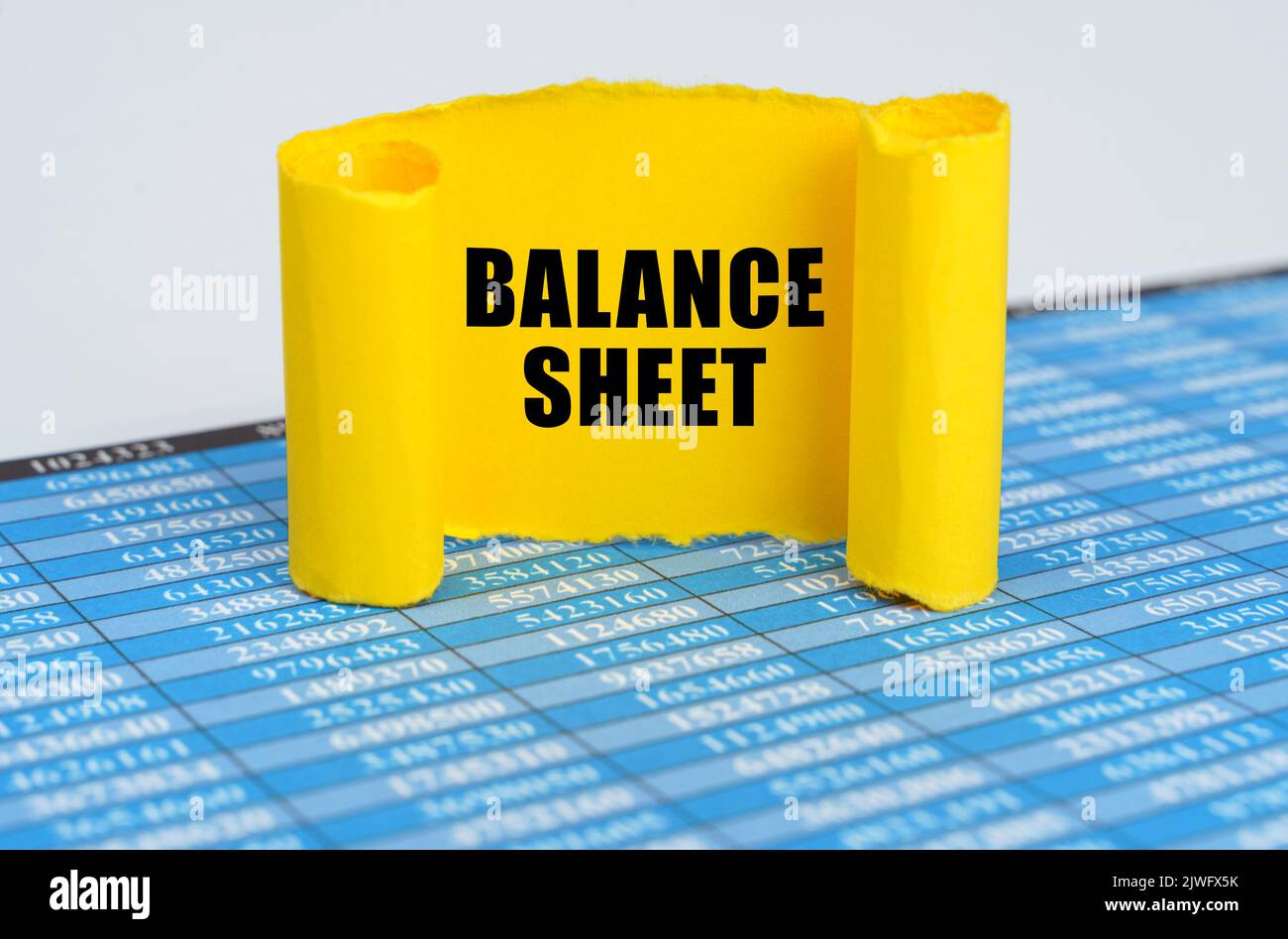 Business concept. On reporting documents, a yellow paper plate with the ...