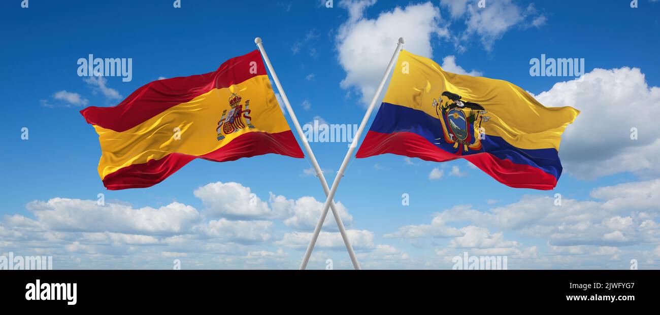 two crossed flags Ecuador and spain waving in wind at cloudy sky ...