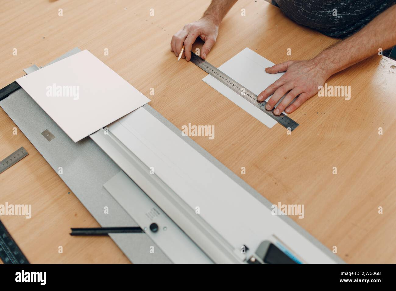 Framing Workshop cutting cardboard carton frame. Making baguette ...