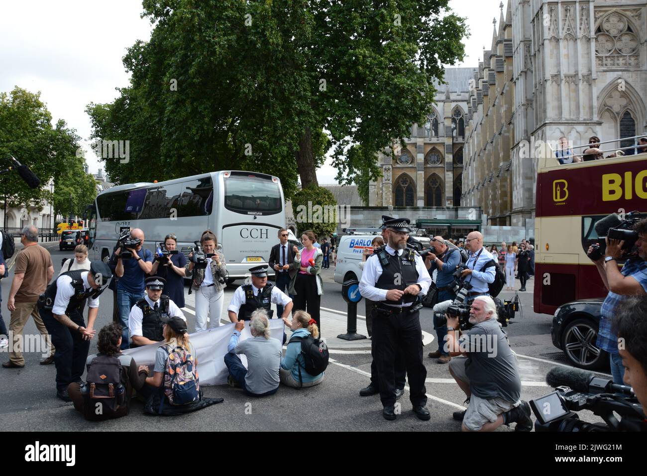 Climate protesters disrupt traffic outside Queen Elizabeth II Centre ...