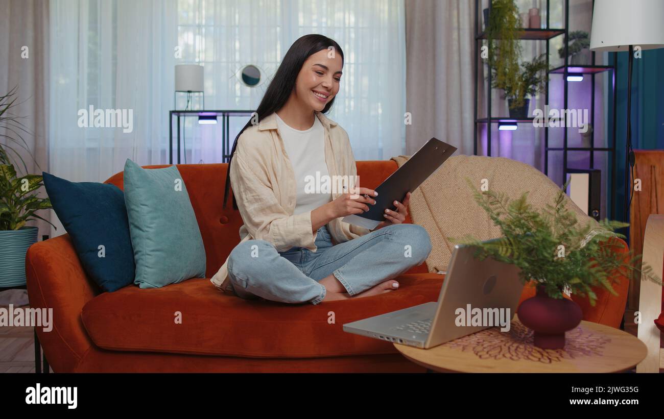 Girl accountant working with financial graph documents, calculate taxes ...