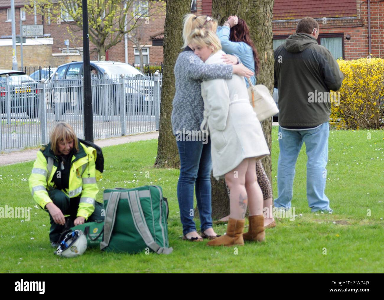 A RESIDENT IS CFOMFORTED BY FRIENDS AFTER A FIRE BARKIS HOUSE ...