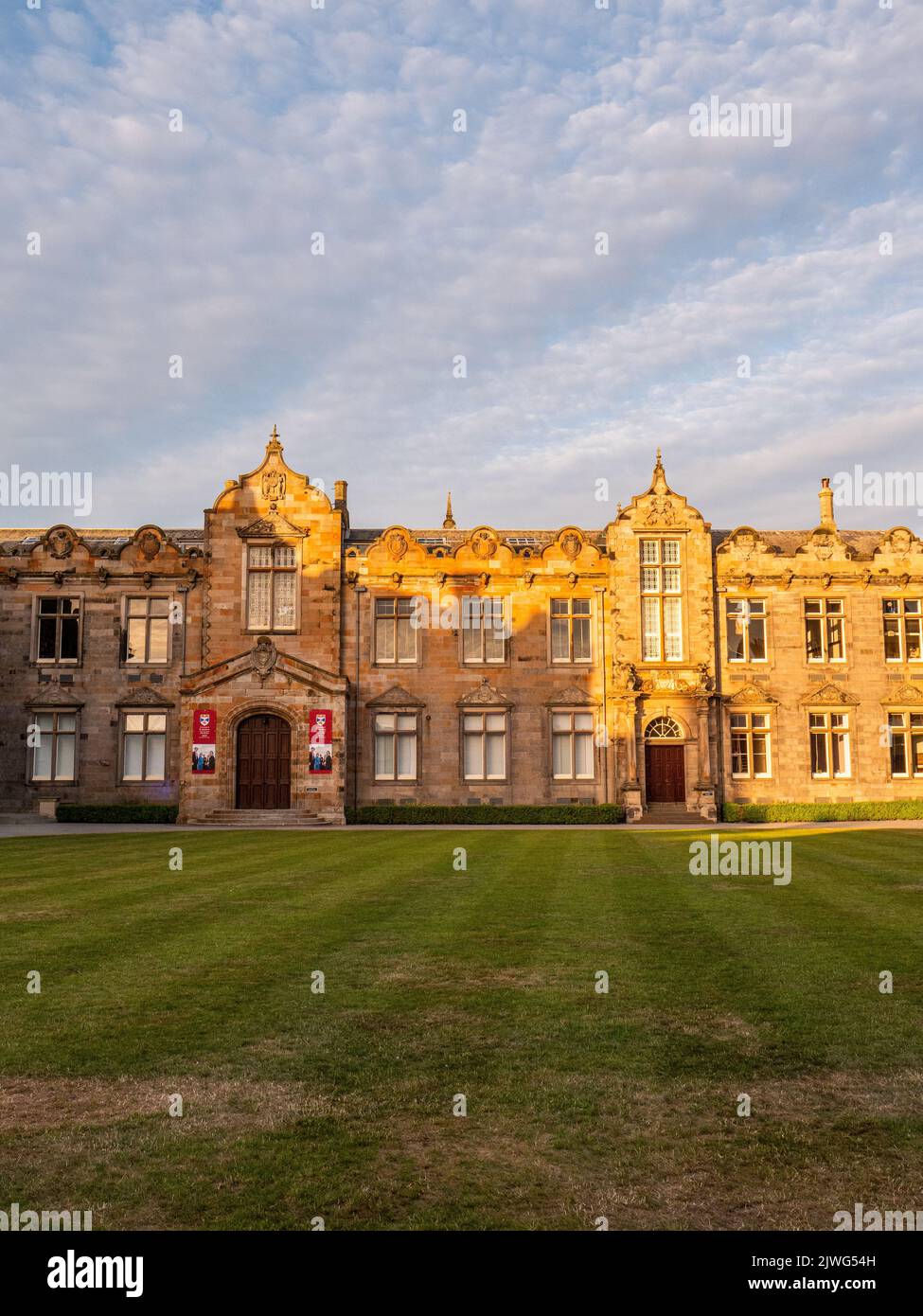 The exterior design of University of St. Andrews against cloudy sky in ...