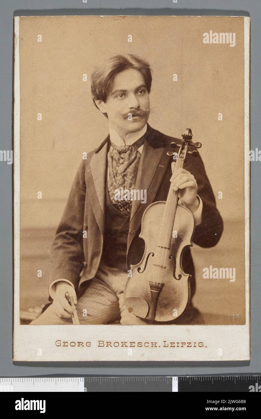 Portrait of musician with violin (view from the knees upwards of a ...