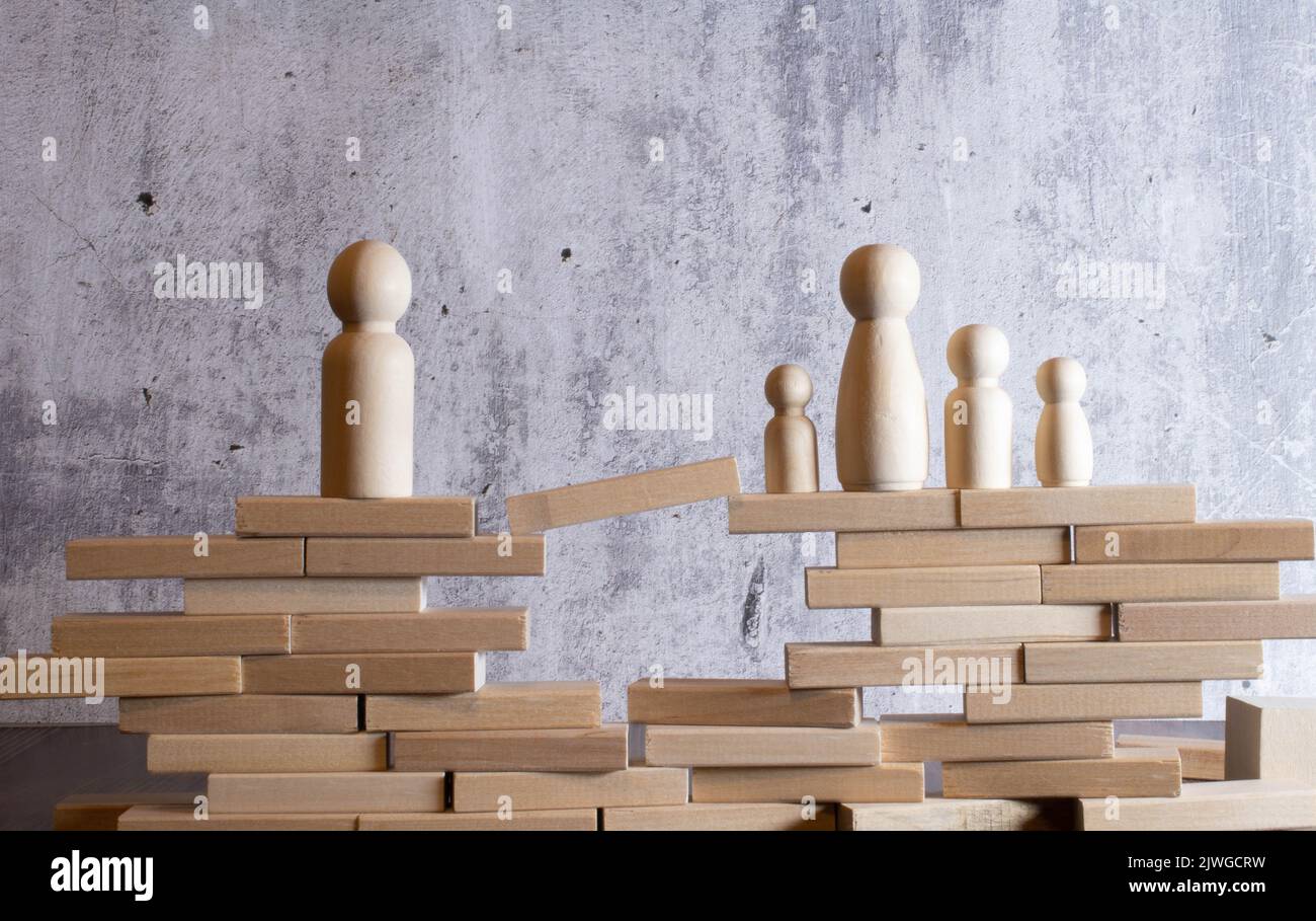 Wooden figurines in the shape of people silhouette, communication ...