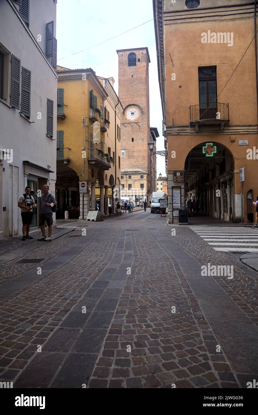 Crossroads with people passing by Stock Photo - Alamy