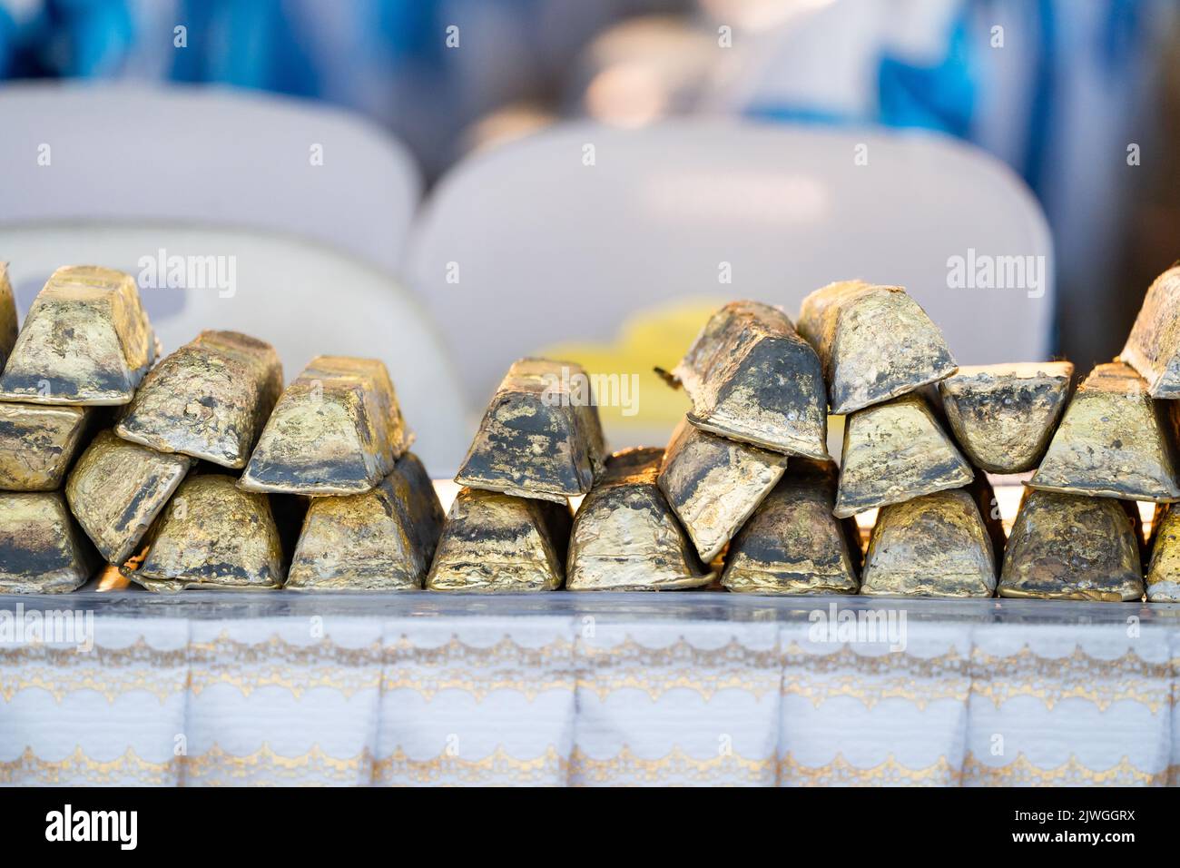 Stack gold bars for making merit and casting Buddha statue were placed ...