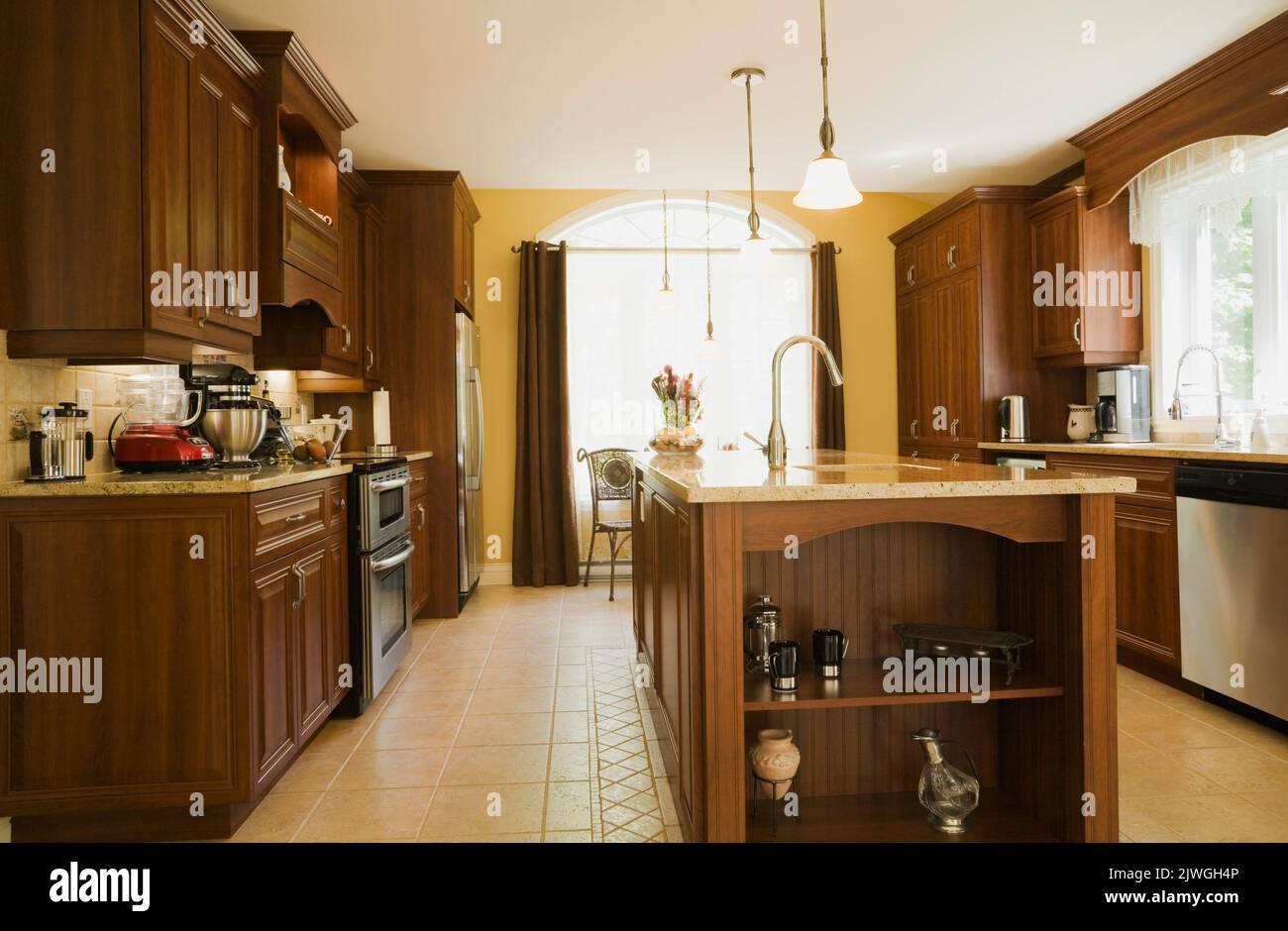 Kitchen room with island inside cottage style home Stock Photo - Alamy