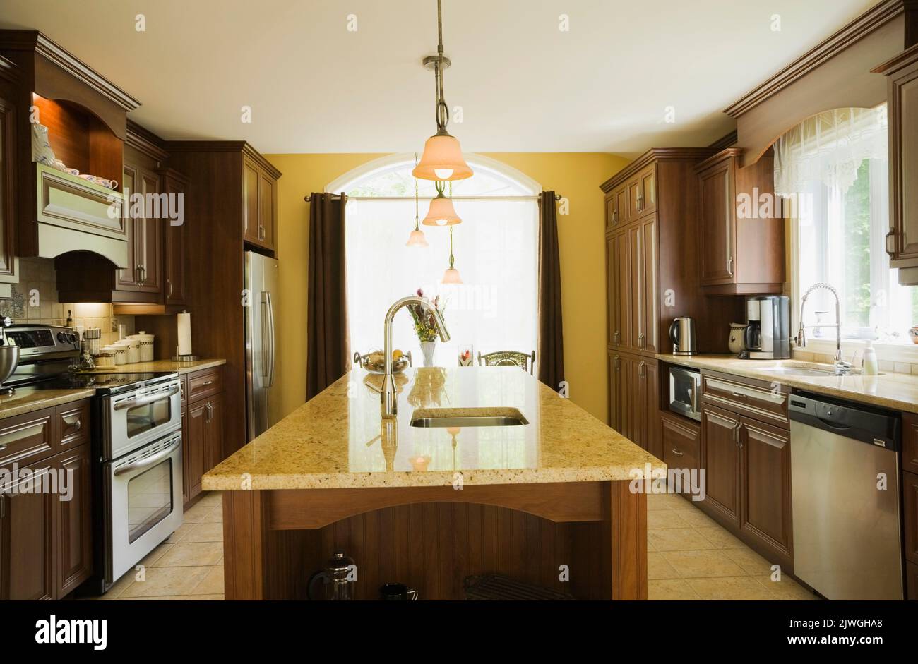 Kitchen room with island inside cottage style home Stock Photo - Alamy