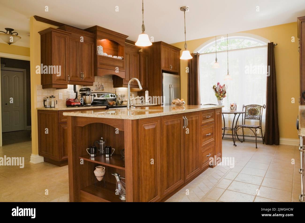 Kitchen room with island inside cottage style home Stock Photo - Alamy