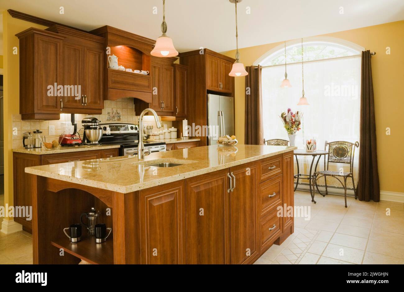 Kitchen room with island inside cottage style home Stock Photo - Alamy