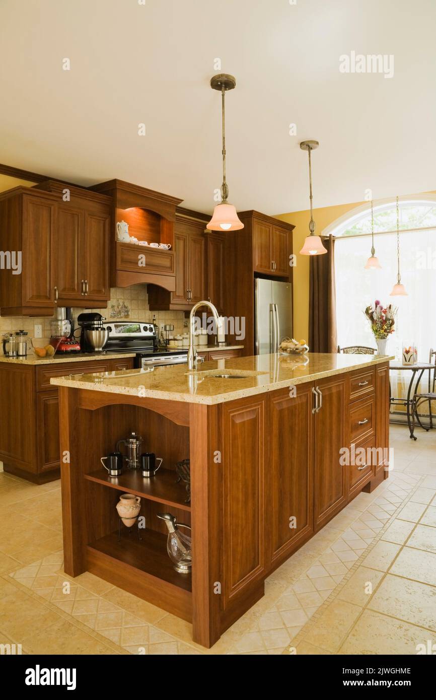Kitchen room with island inside cottage style home Stock Photo - Alamy