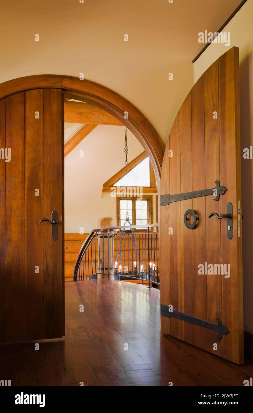 Medieval style arched wooden doors of original master bedroom on ...