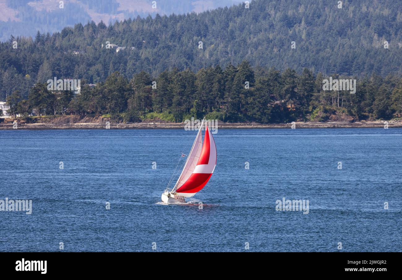 Sailboat in Canadian Landscape by the ocean and mountains Stock Photo ...