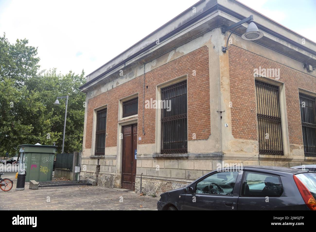 Brick utility building in a square on a cloudy day Stock Photo - Alamy