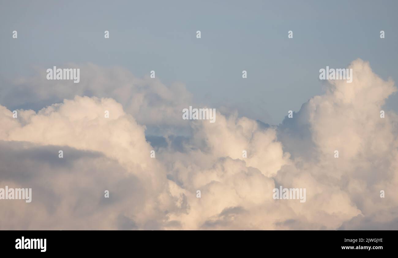 Puff Clouds in the Sky during sunset Stock Photo - Alamy