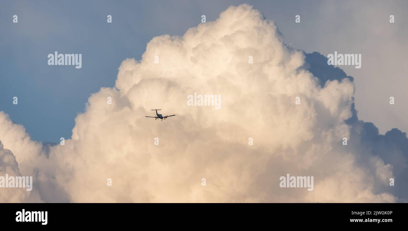 Puff Clouds in the Sky during sunset Airplane Flying. Zoom in Stock ...