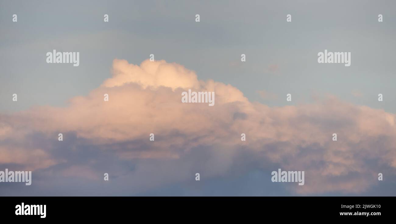 Puff Clouds in the Sky during sunset. Zoom in Stock Photo - Alamy