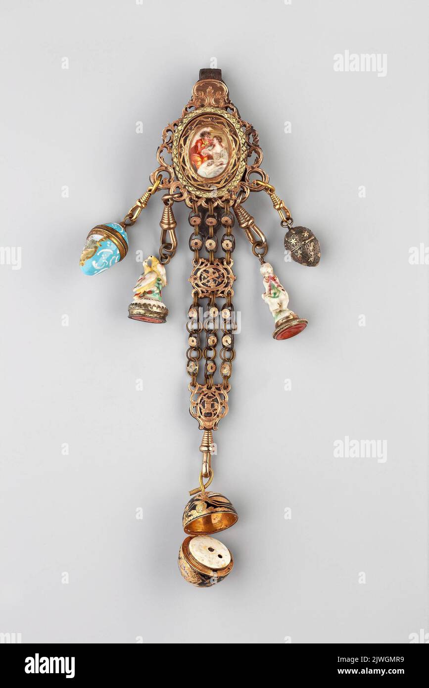 Chatelaine with a small chain watch, stamps and trinkets. Moilliet ...
