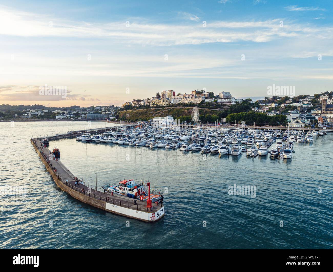 Sunset over Torquay Harbour and Marina, English Riviera from a drone ...