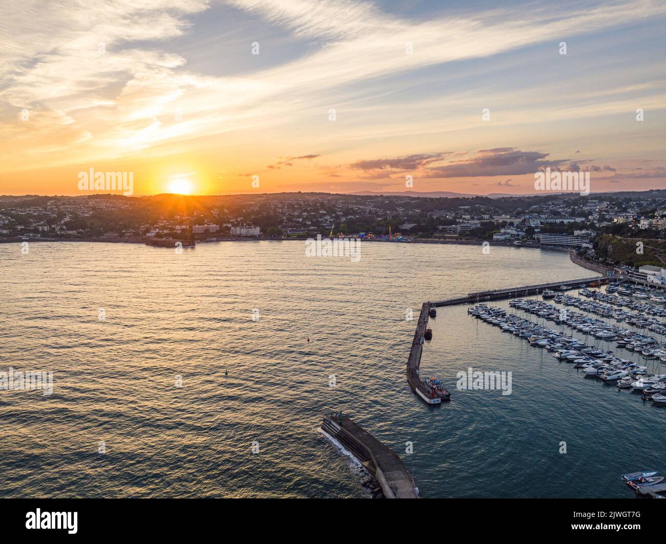 Sunset over Torquay Harbour and Marina, English Riviera from a drone ...