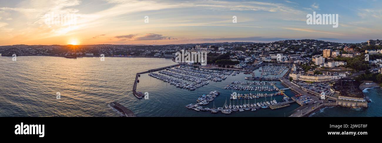 Sunset over Torquay Harbour and Marina, English Riviera from a drone ...