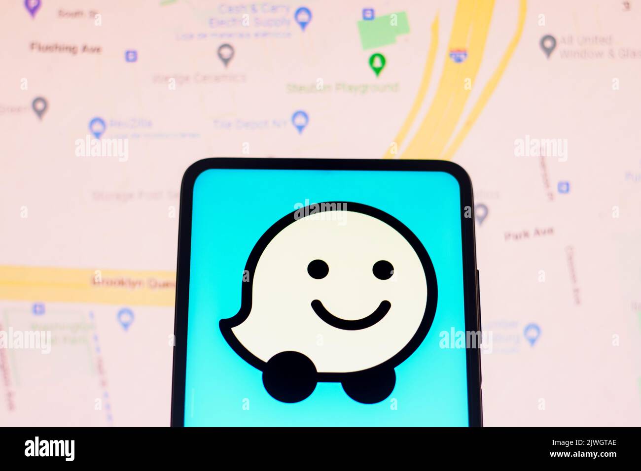 In this photo illustration, the Waze logo is displayed on a smartphone ...