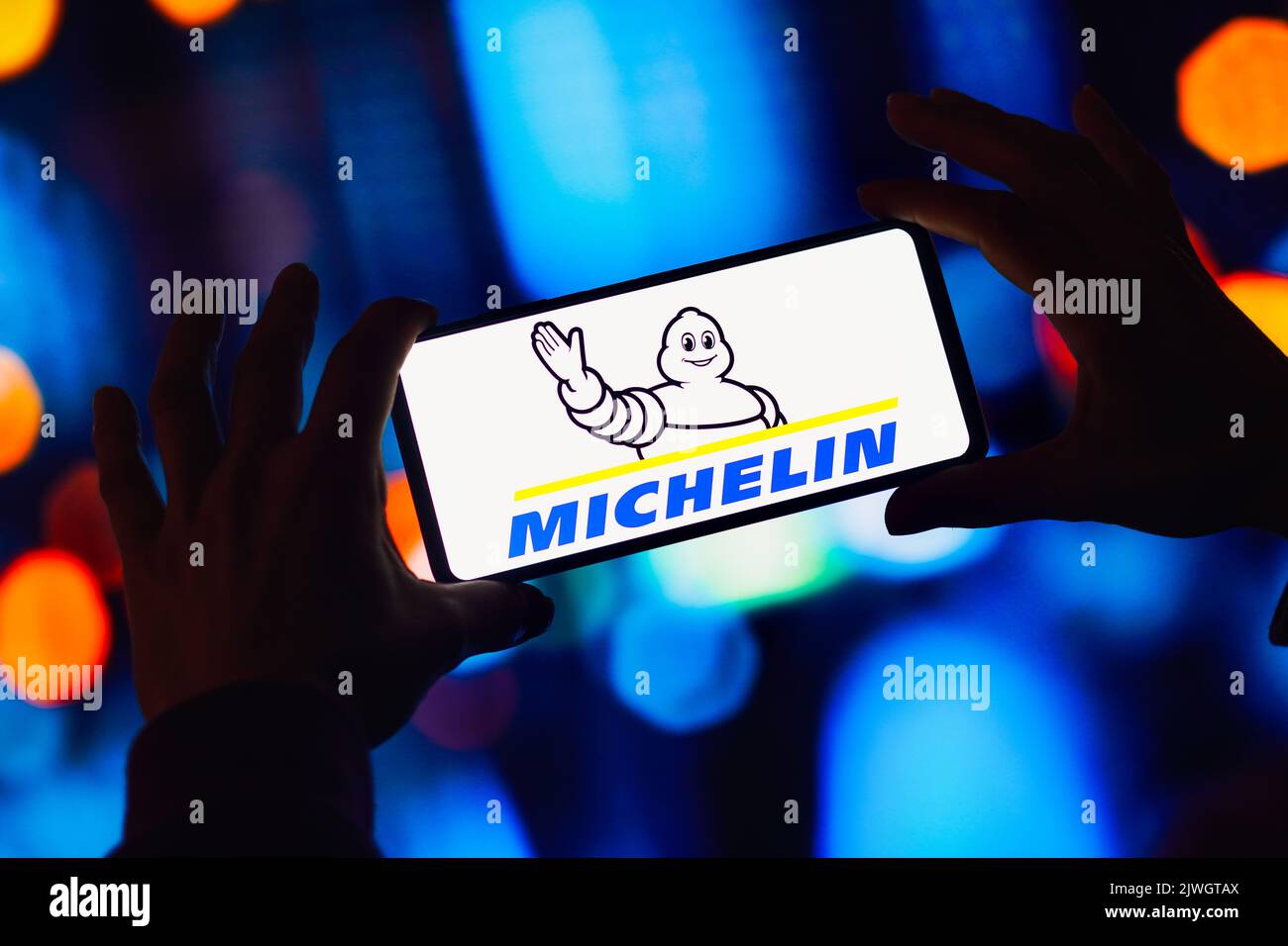 In this photo illustration, the Michelin logo is displayed on a ...