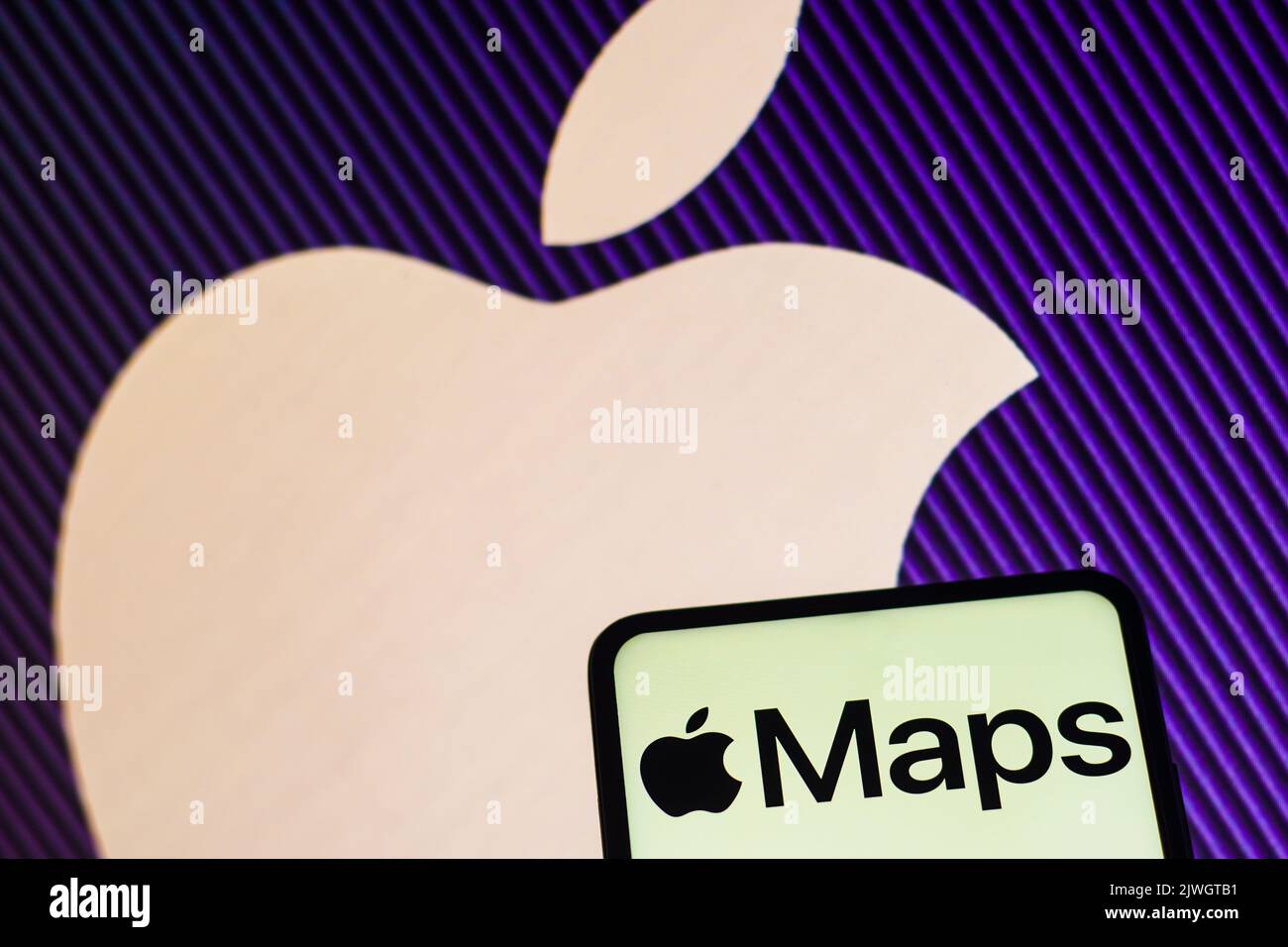 In this photo illustration, the Apple Maps logo is displayed on a ...