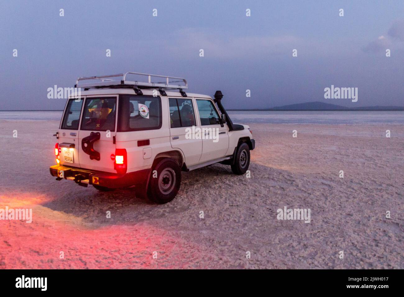 DANAKIL, ETHIOPIA - MARCH 24, 2019: Tourist vehicle at the salt plain ...