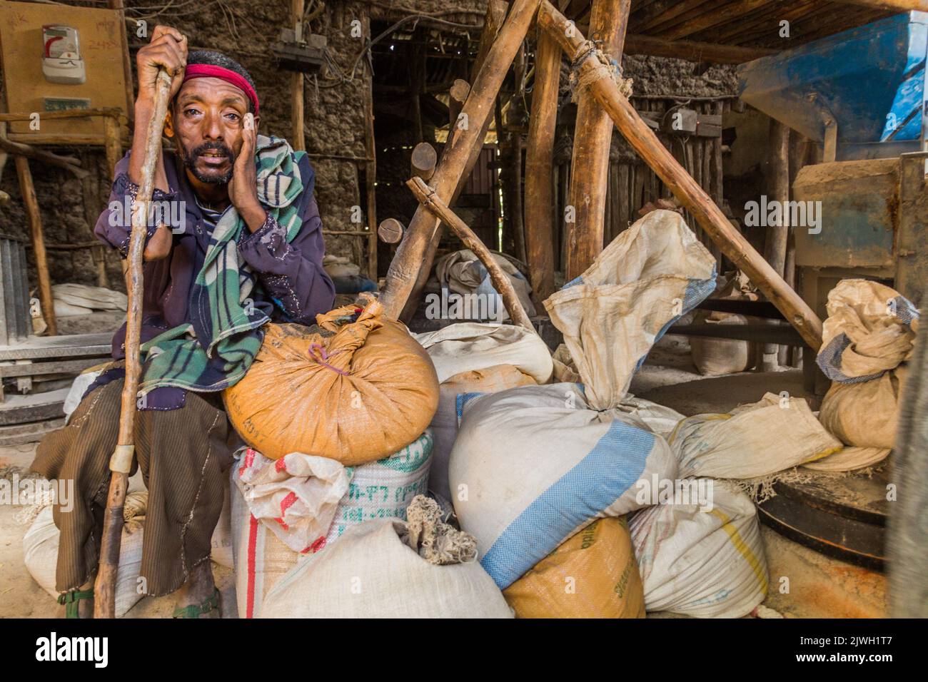 LALIBELA, ETHIOPIA - MARCH 29, 2019: Local man with bags of flour and ...