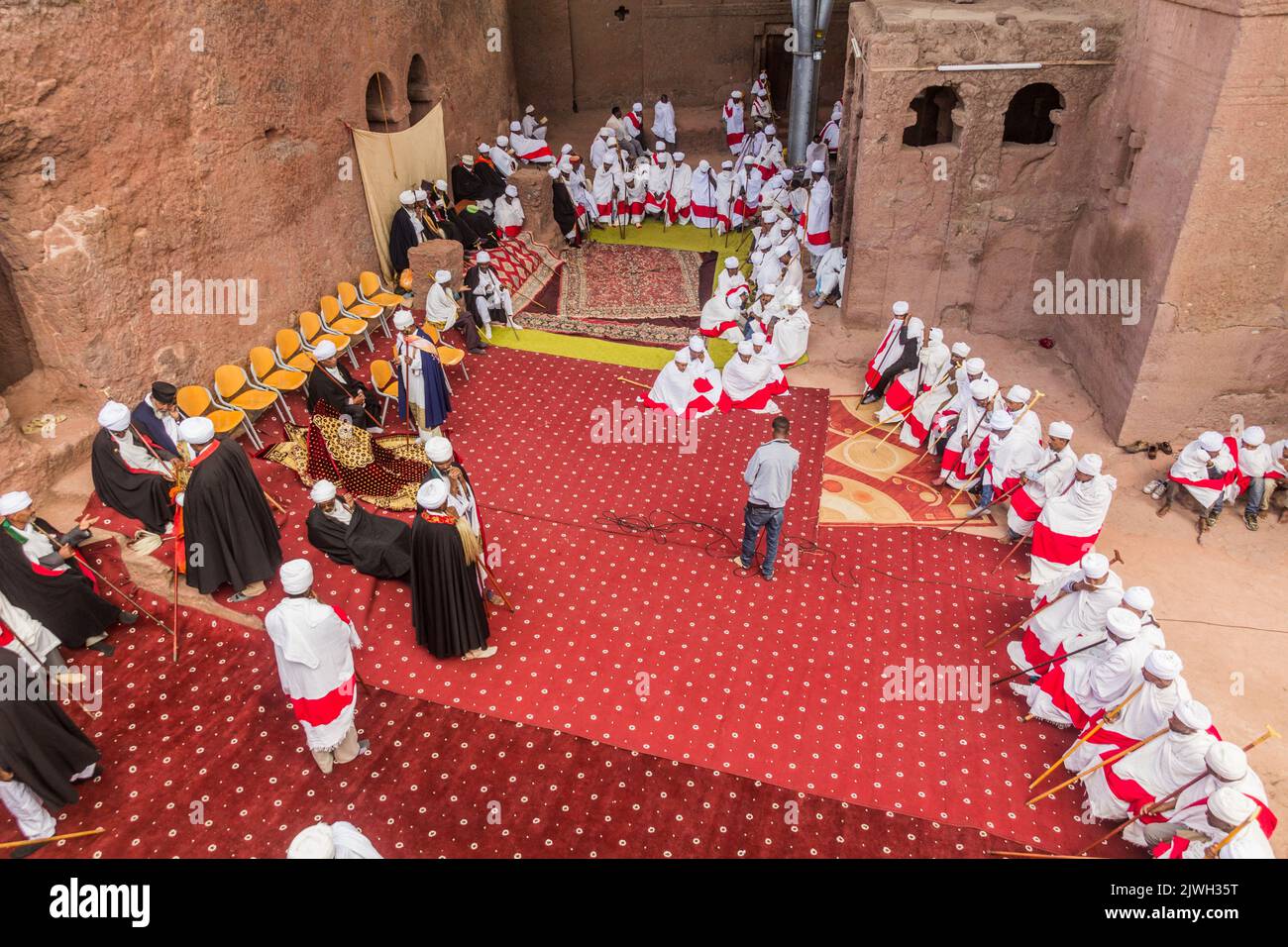 LALIBELA, ETHIOPIA - MARCH 29, 2019: Christian priests in front of Bet ...