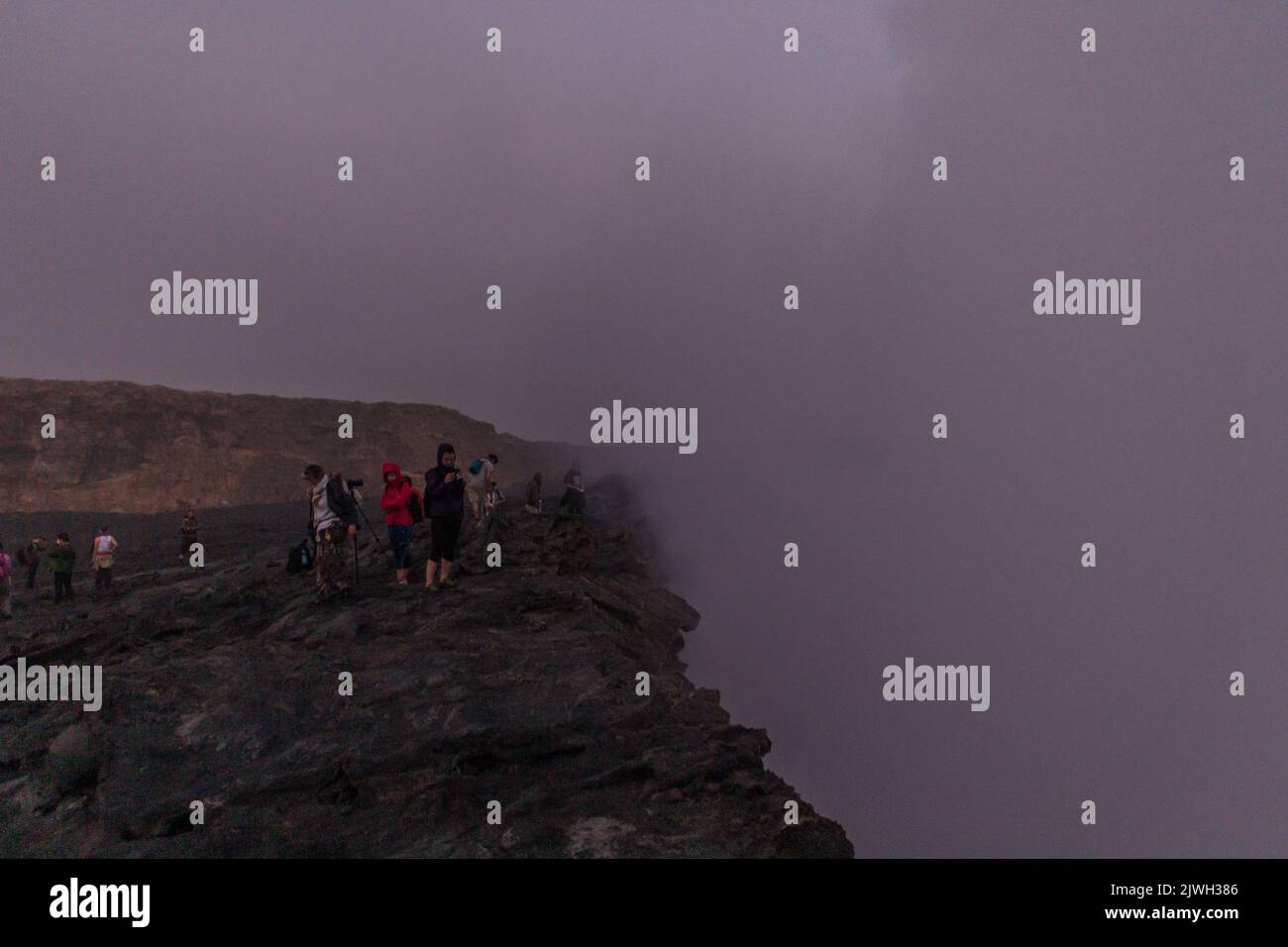 AFAR, ETHIOPIA - MARCH 26, 2019: Tourists at the edge of Erta Ale ...