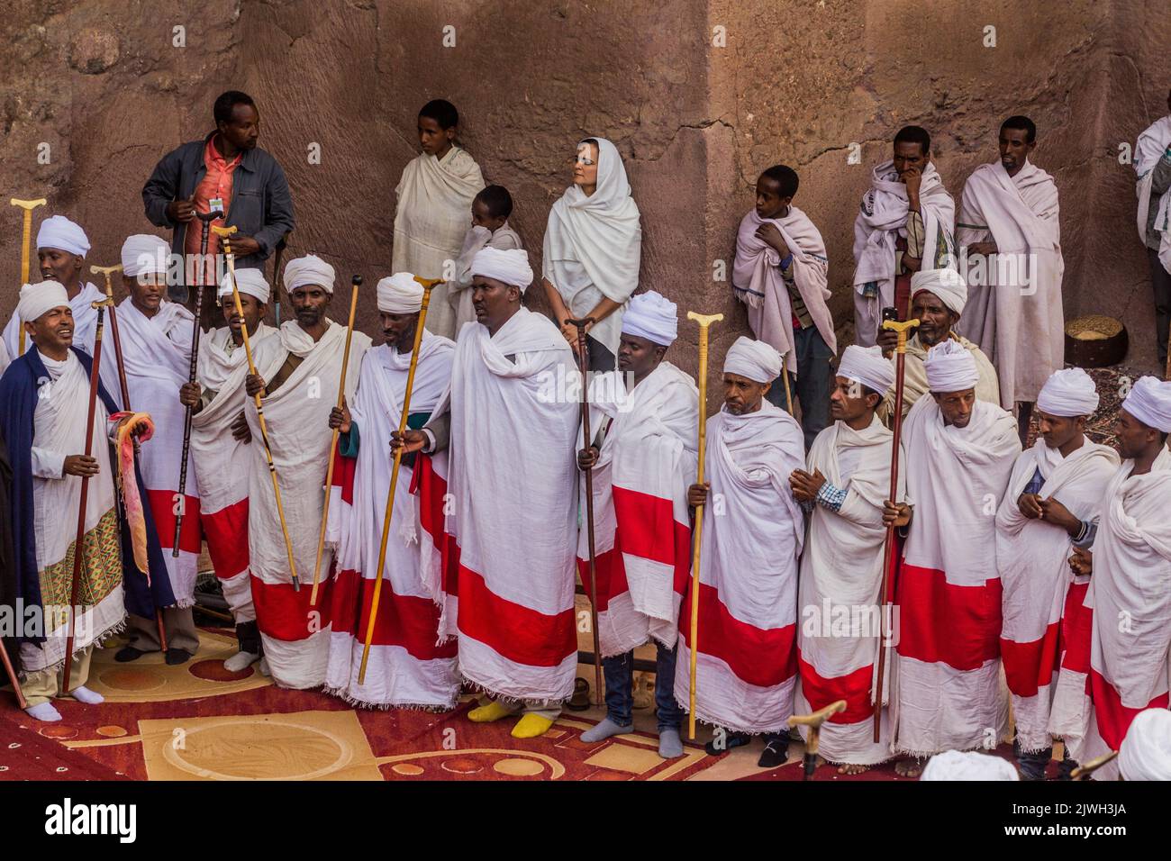 LALIBELA, ETHIOPIA - MARCH 29, 2019: Christian priests in front of Bet ...