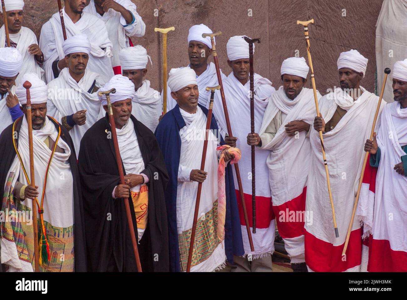 LALIBELA, ETHIOPIA - MARCH 29, 2019: Christian priests in front of Bet ...