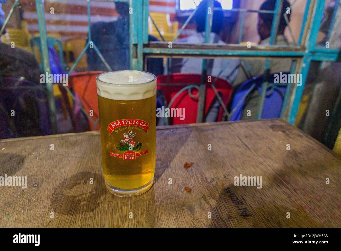 LALIBELA, ETHIOPIA - MARCH 29, 2019: Glass of St. George beer in a pub ...