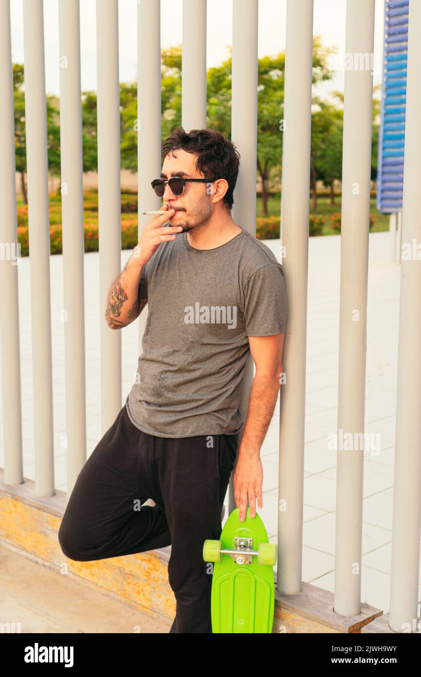 Cool guy smoking a cigarette hi-res stock photography and images - Alamy