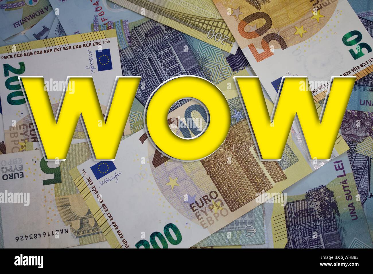 Wow word with money. Paper currency background with different banknotes ...