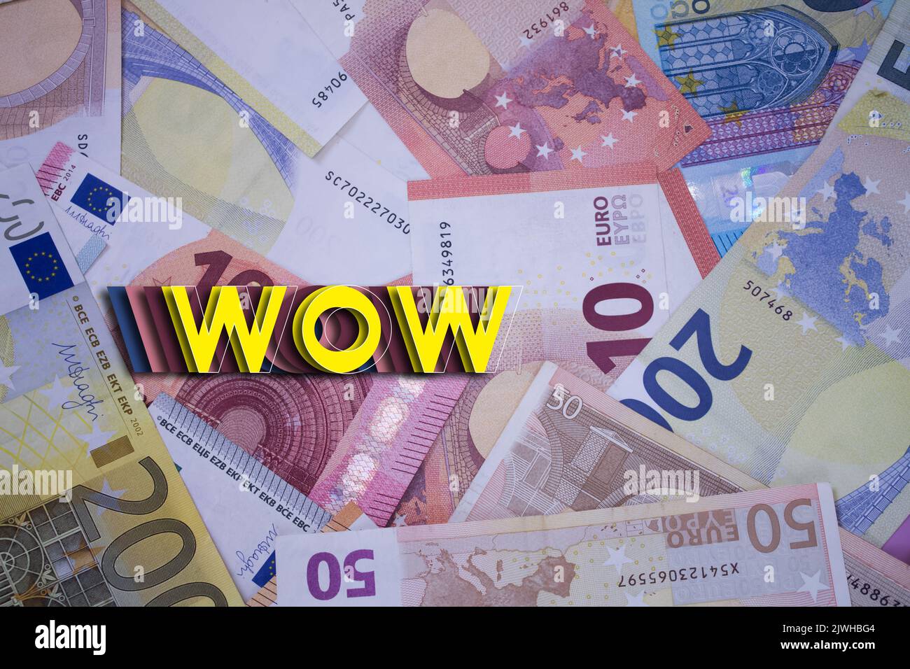 Wow word with money. Paper currency background with different banknotes ...