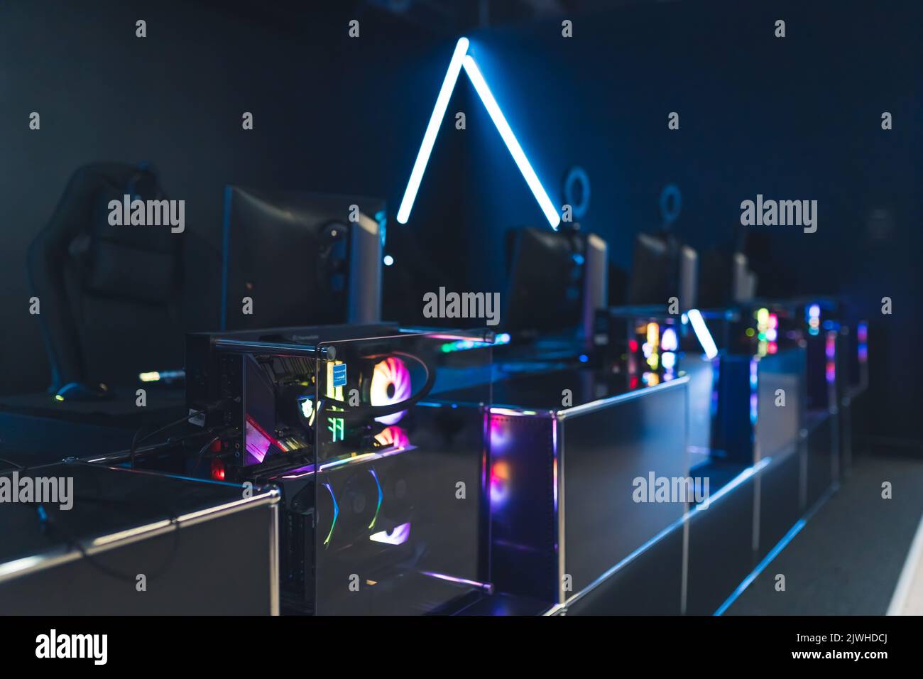 Monitors and computers in trapnsparent cases with rainbow glowing fans ...