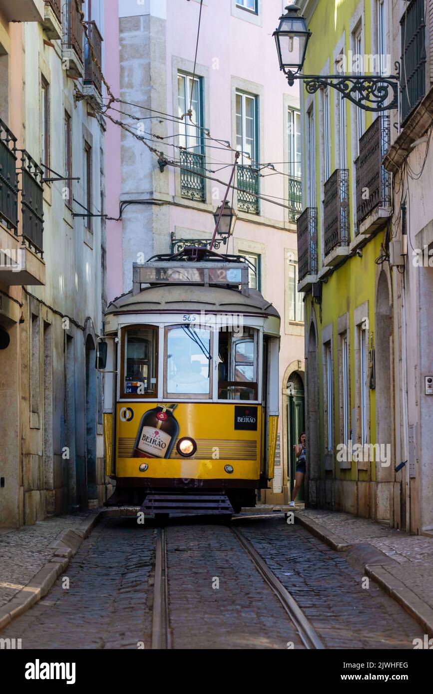 A tram seen running through one of the streets in the Graca district ...