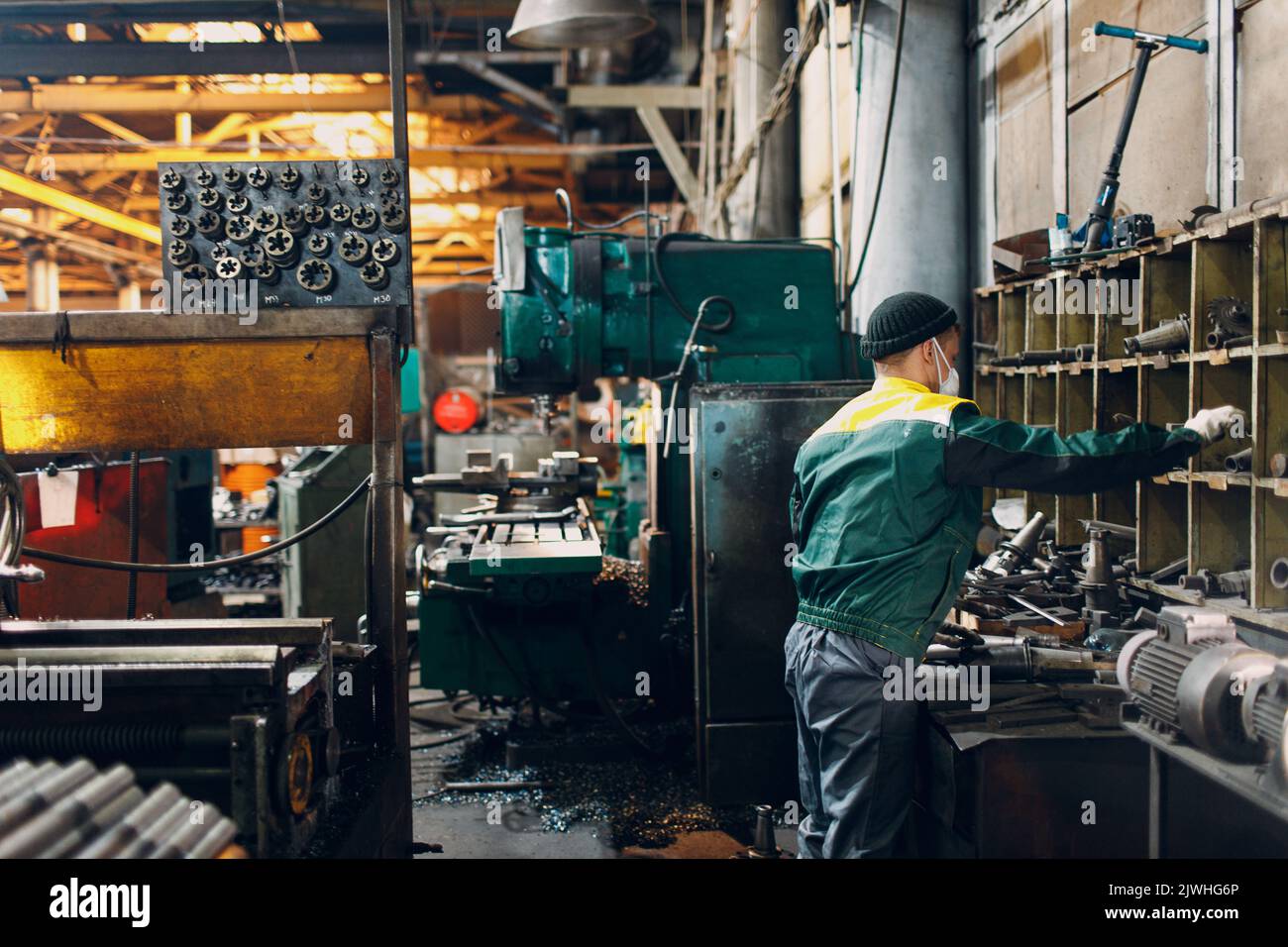 Workers working with steel structure parts construction at industrial ...