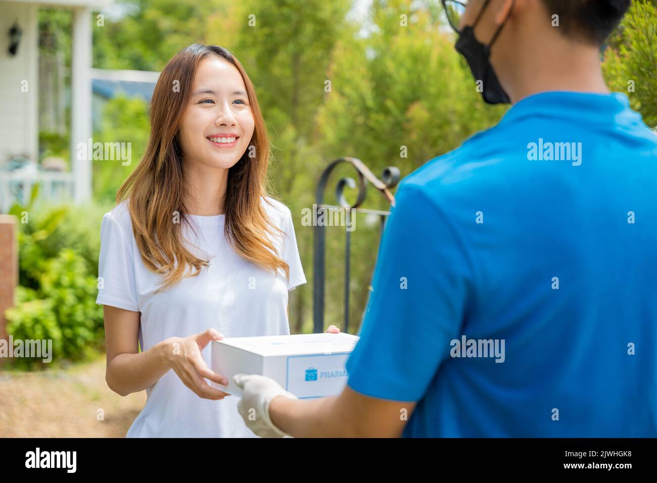 Sick Asian young woman receive medicine first aid pharmacy box from ...